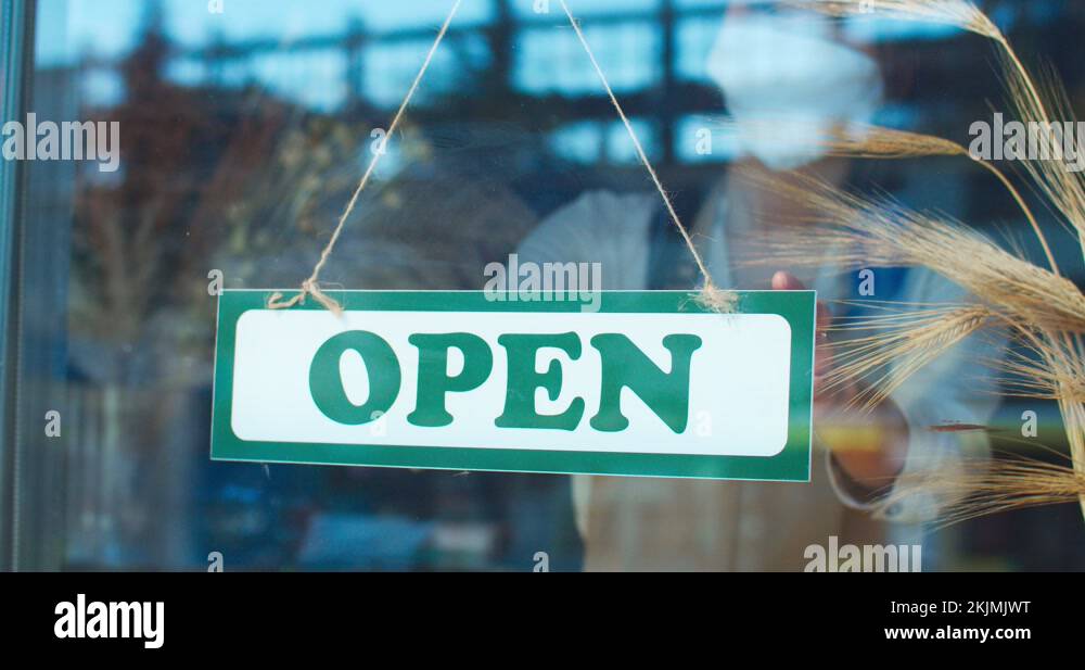 Asian female florist shop owner closing store due to pandemic period ...