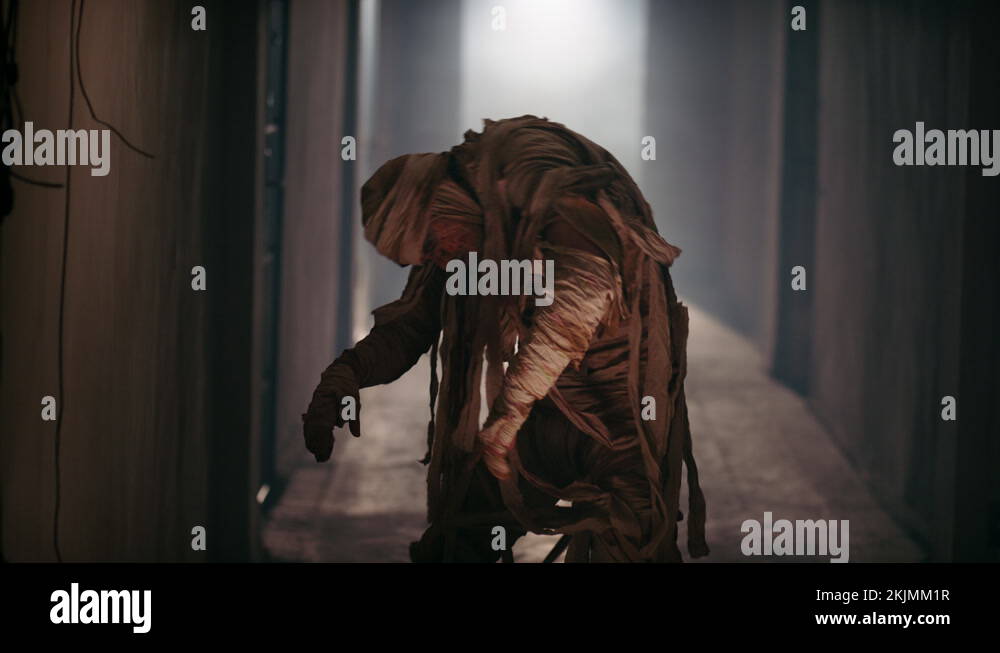 Scary ancient mummy in bandages in haunted house. Guy in thematic ...