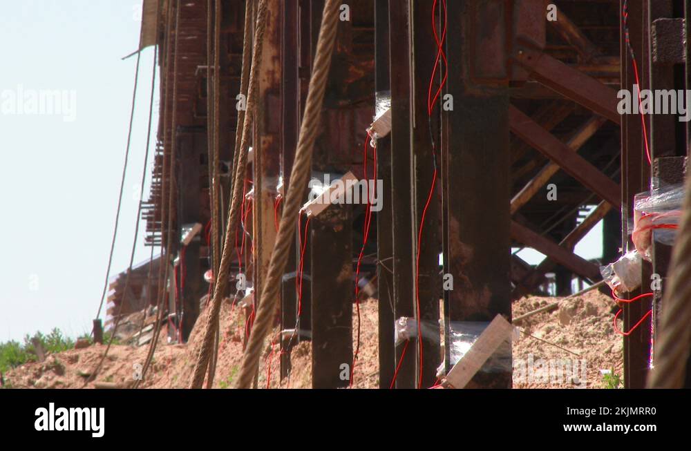 Mining of a metal structure with a red dynamite block TNT. Blasting ...