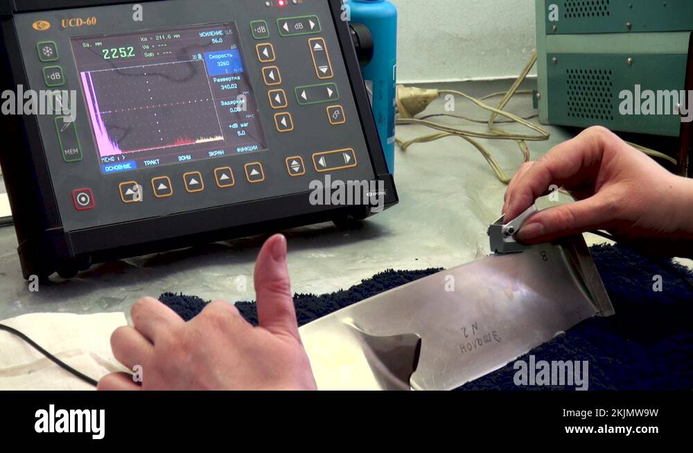 Checking condition of rotor blades. Ultrasonic testing. Finder on edge ...