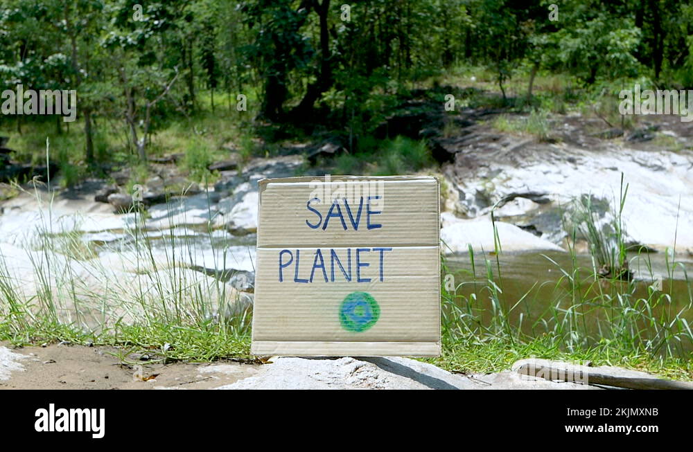 The nature conservation sign on stream flowing background.World ...