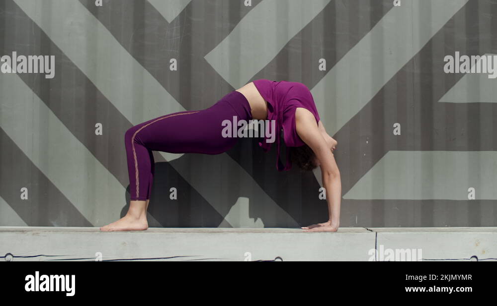 Young Gymnast Woman In Purple Performs Bending Over Backwards In Slow Motion Stock Video Footage