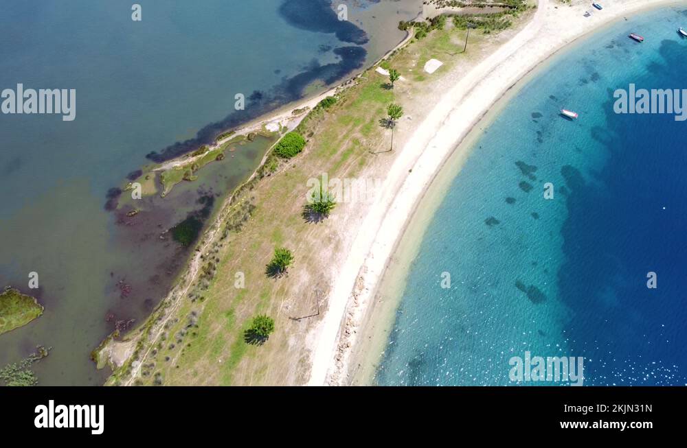 bay with sand beach and clean water on right and dirty on left side ...