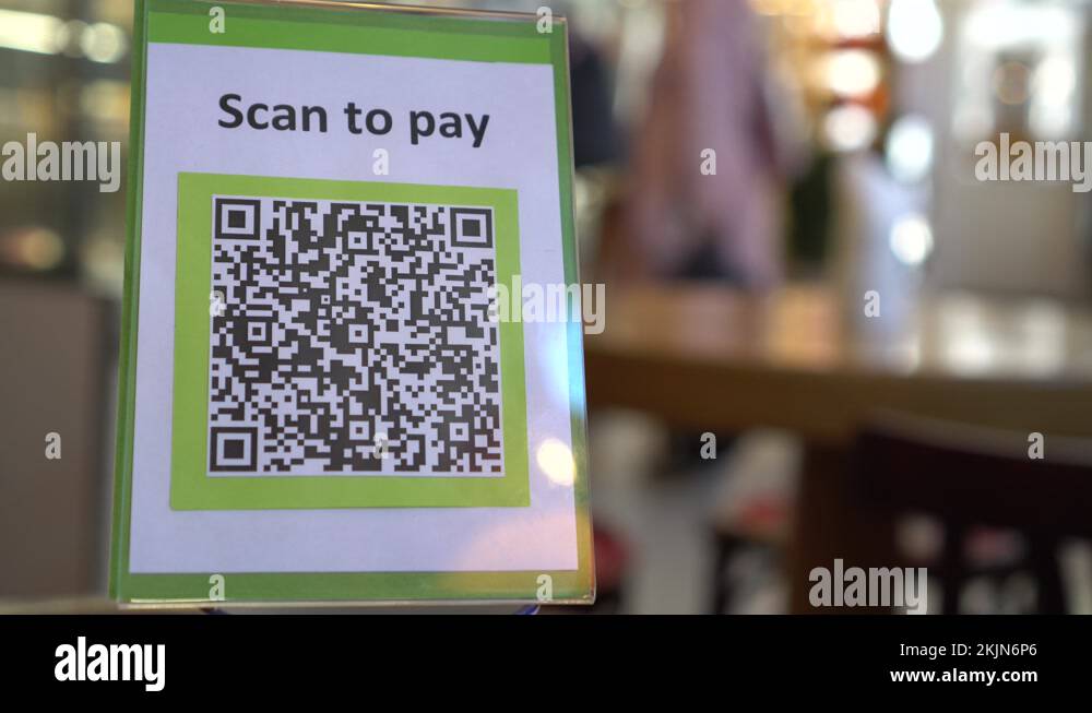 Paying with QR Code. QR code display in a restaurant. Touch Free ...