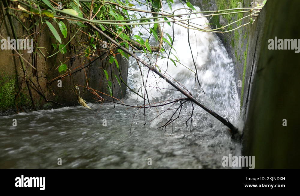 Water flow in drainage concrete ditch. local waterway Stock Video ...