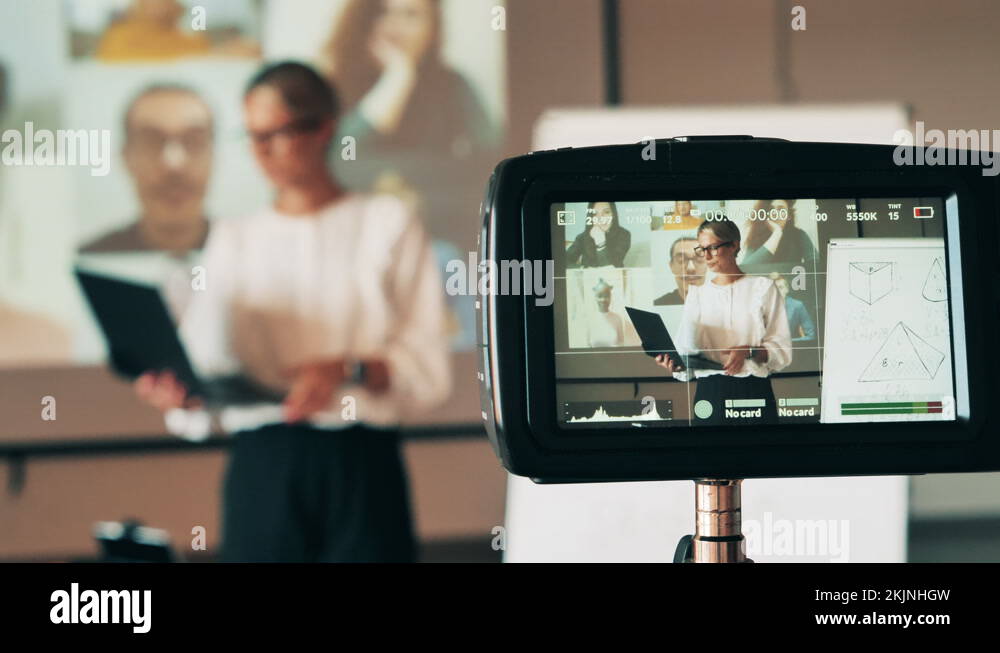 Female teacher during an online class shown through the camera Stock ...
