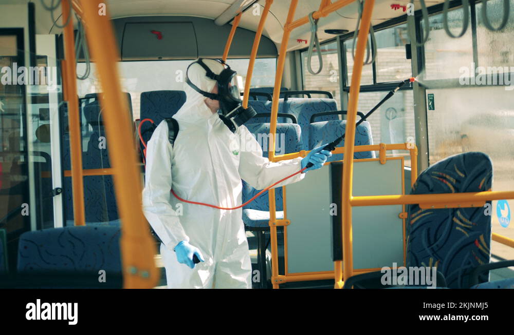 Coronavirus prevention concept. A person in a hazmat suit is ...