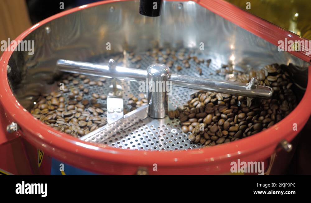 Mixing and roasting process - coffee roaster machine during work: slow ...