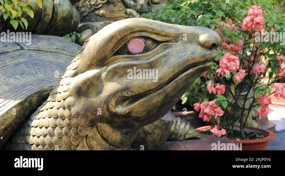 A statue turtle at Suoi Tien park in Ho Chi Minh Vietnam handheld Stock ...