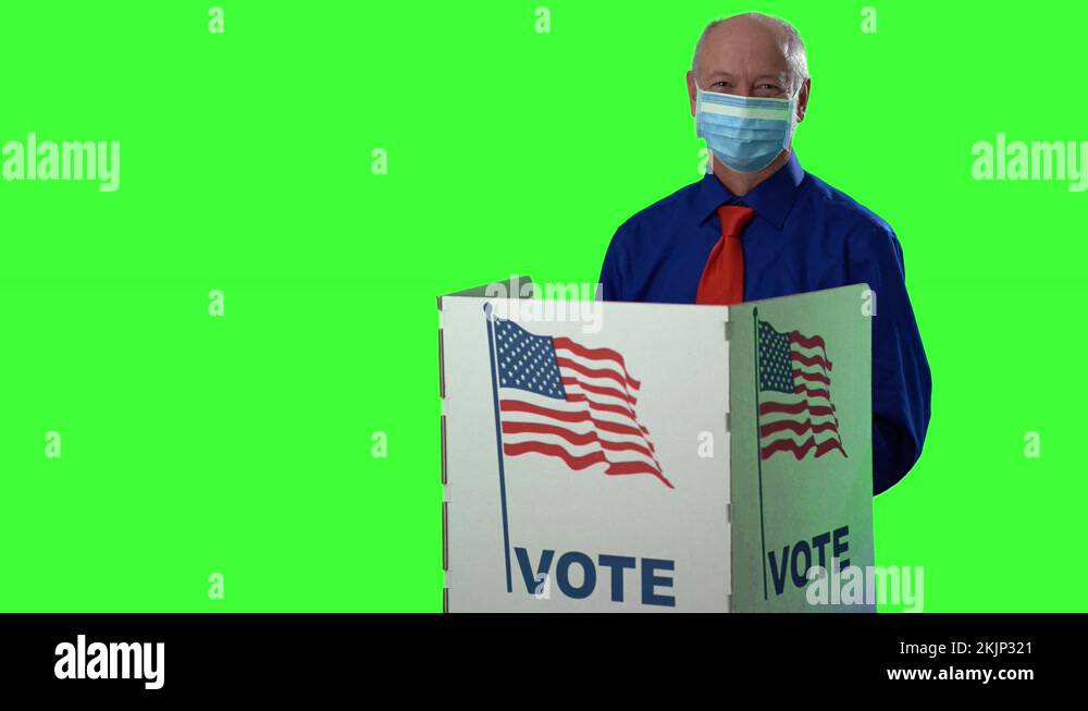 Conceptual green screen portrait of smiling happy man in voting booth ...