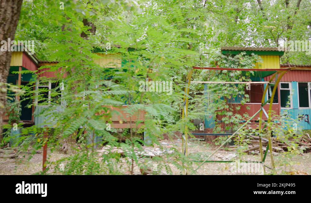 Abandoned recreation center and houses in the forest. Poverty and ...