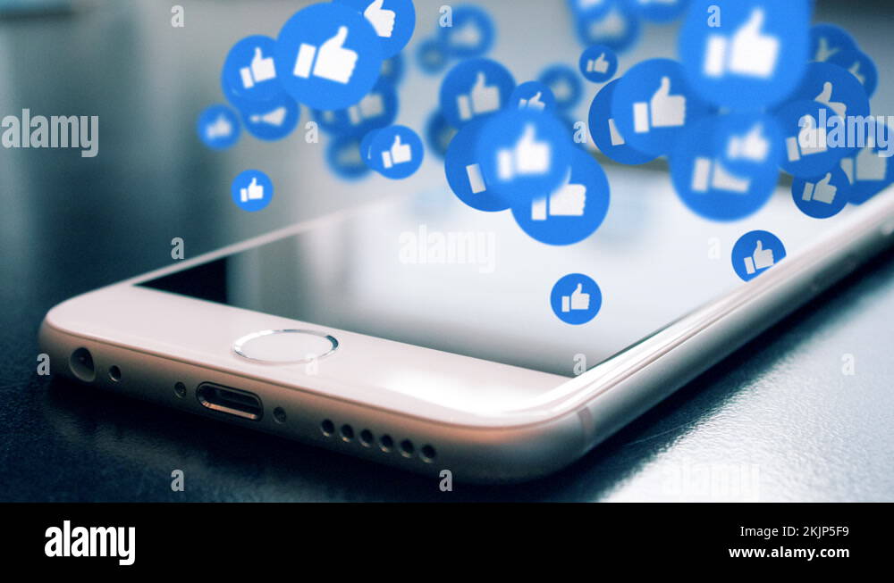 Smartphone floating social network thumbs up icons. Social media ...
