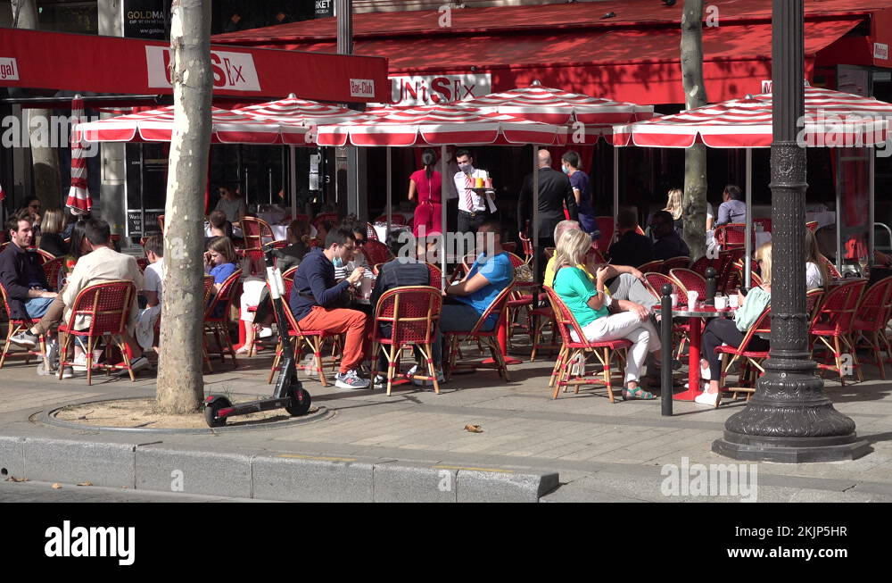 People sitting outside at a paris cafe restaurant Stock Videos ...