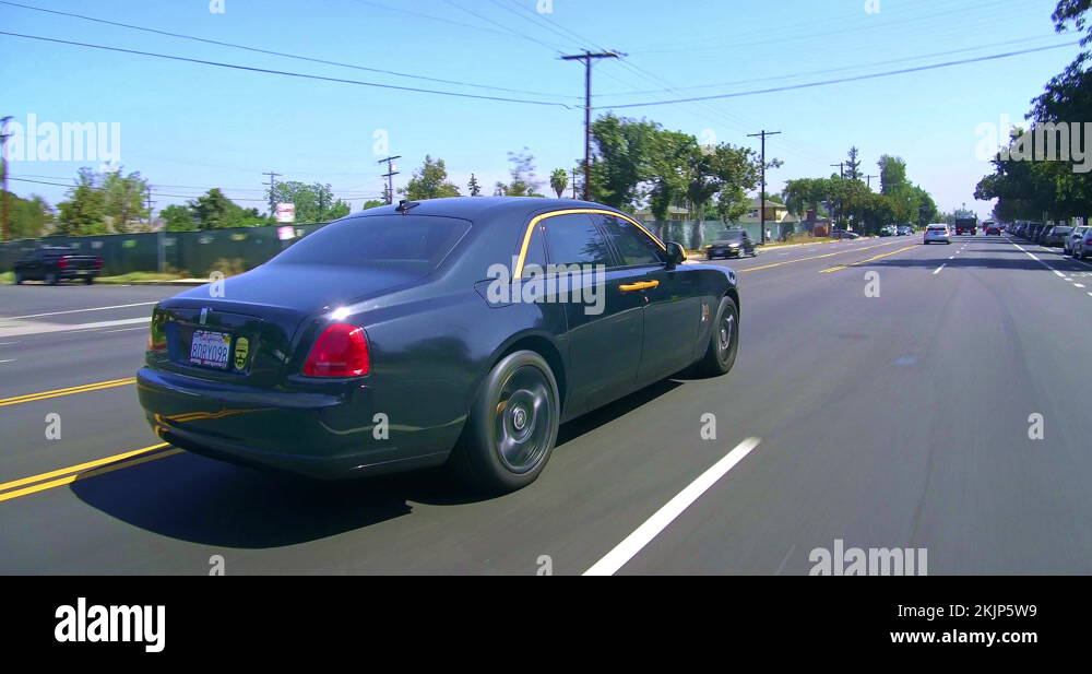 Rolls-Royce luxury car driving on the street of Los Angeles, California ...