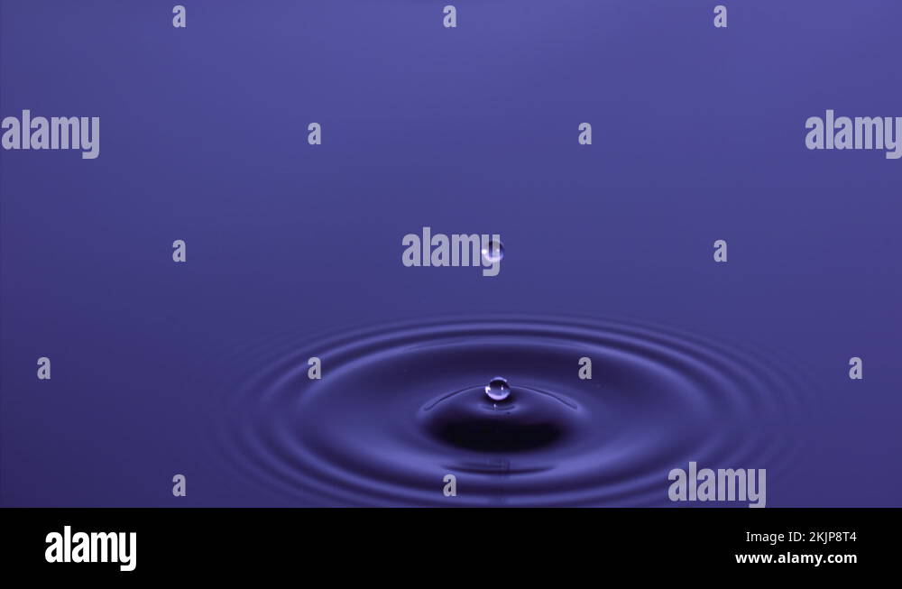 Droplet Falling Into Liquid And Causing Ripples Stock Video Footage - Alamy