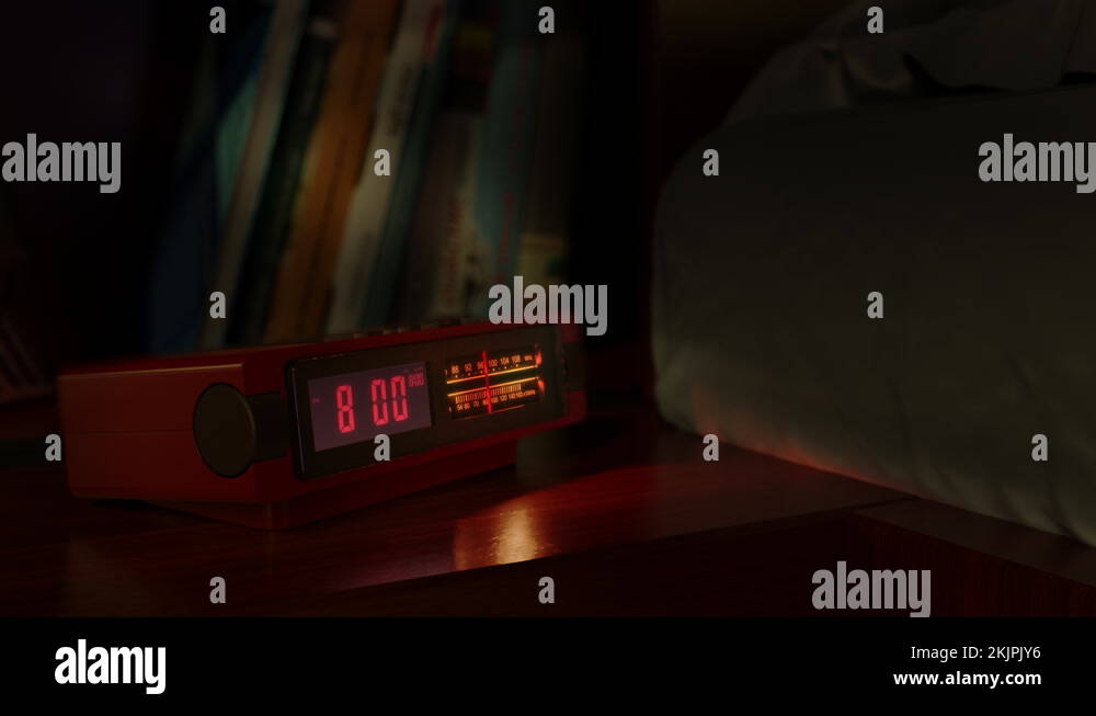 Vintage alarm clock with digital dial and radio waking up at 8 AM Stock ...