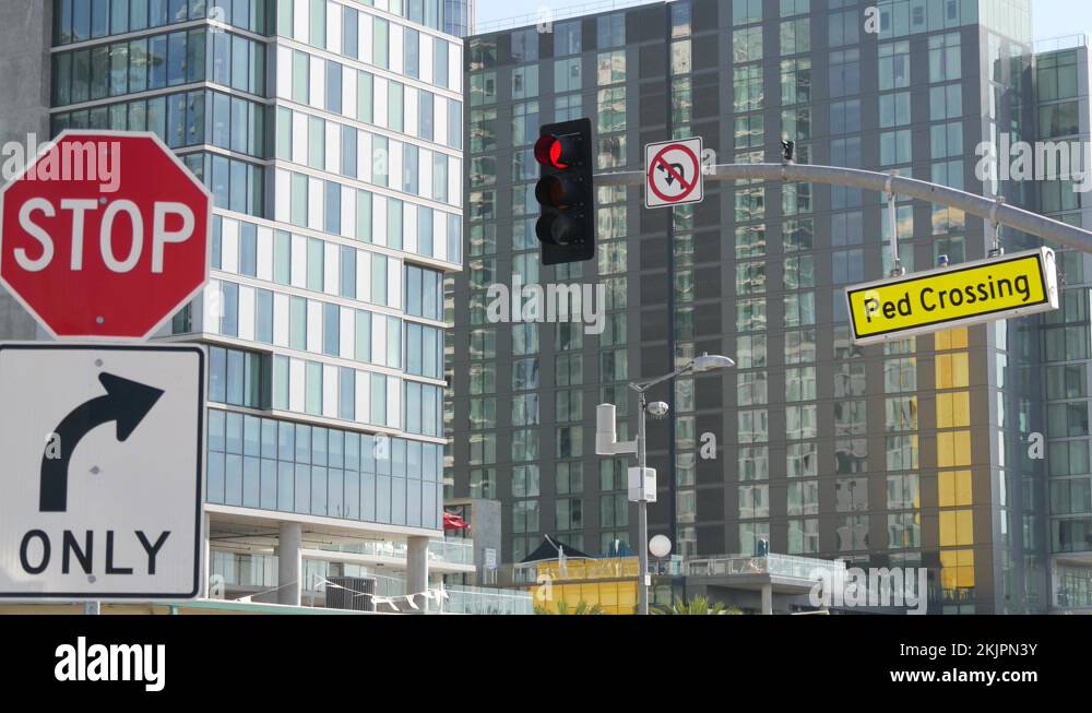 Traffic light and caution sign, road intersection in USA ...