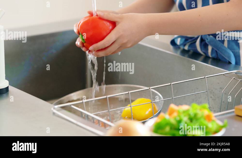 Washing vegetables in kitchen Stock Videos & Footage - HD and 4K Video ...
