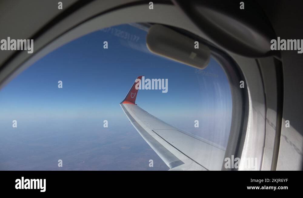 Blue sky and a plane wing viewed from the cabin window Stock Video ...