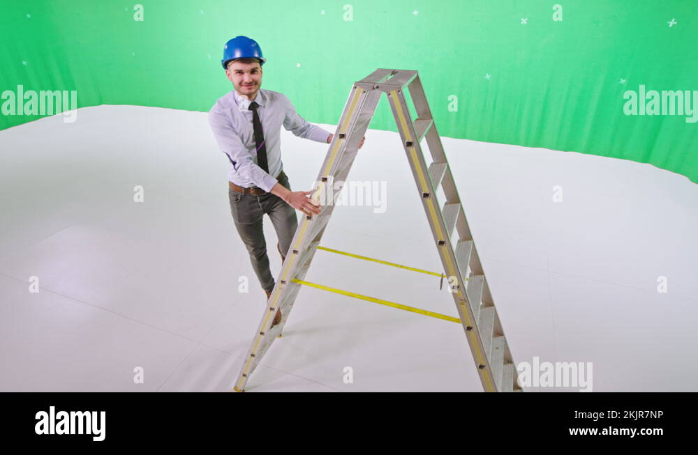 Chroma key studio good looking guy architect with a safety helmet ...