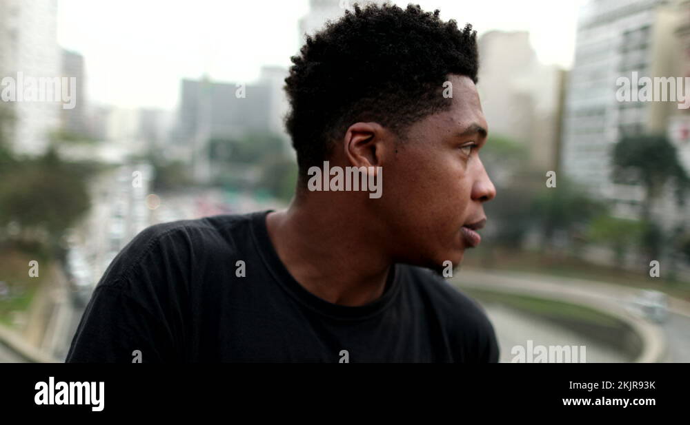 Frustrated young black man in downtown. Pensive African guy in urban ...