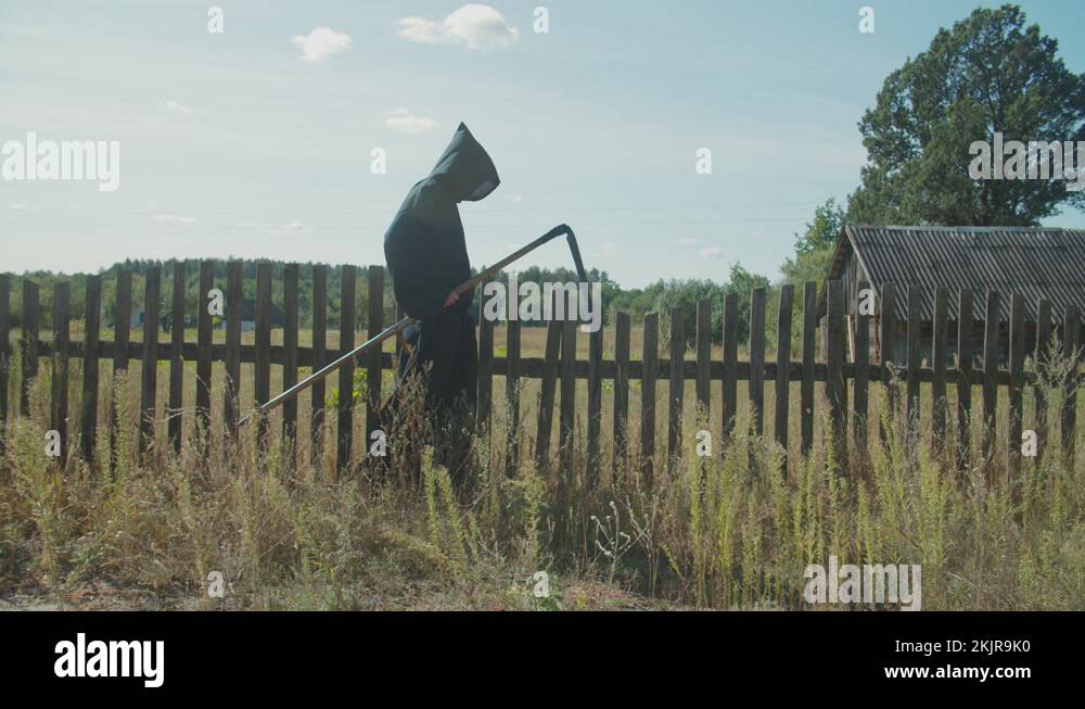 Scary grim reaper with scythe haunting for souls Stock Video Footage ...