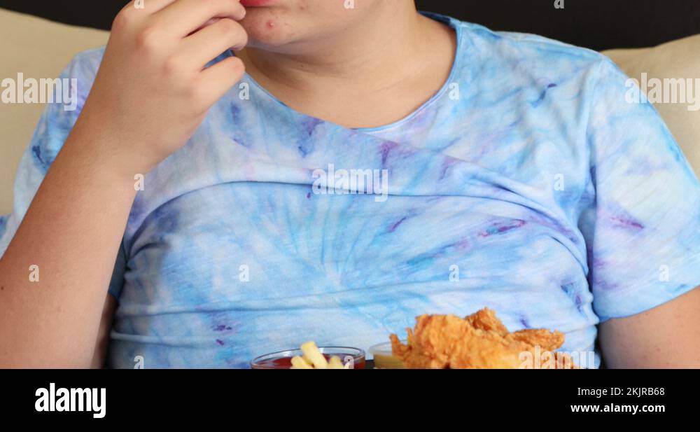 Teenage boy eating fried crispy chicken and french fries 2 Stock Video ...