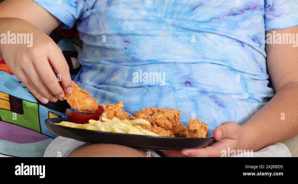Teenage boy eating fried crispy chicken and french fries 6 Stock Video ...
