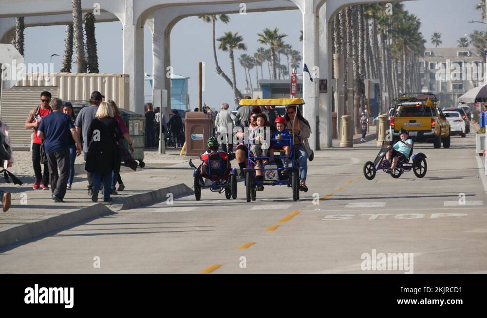 People walking, waterfront promenade beachfront boardwalk. Ocean beach ...