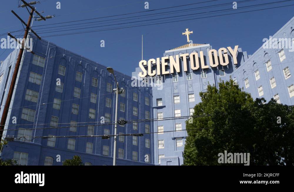 Church of Scientology exterior, facade of blue building, logo and cross ...
