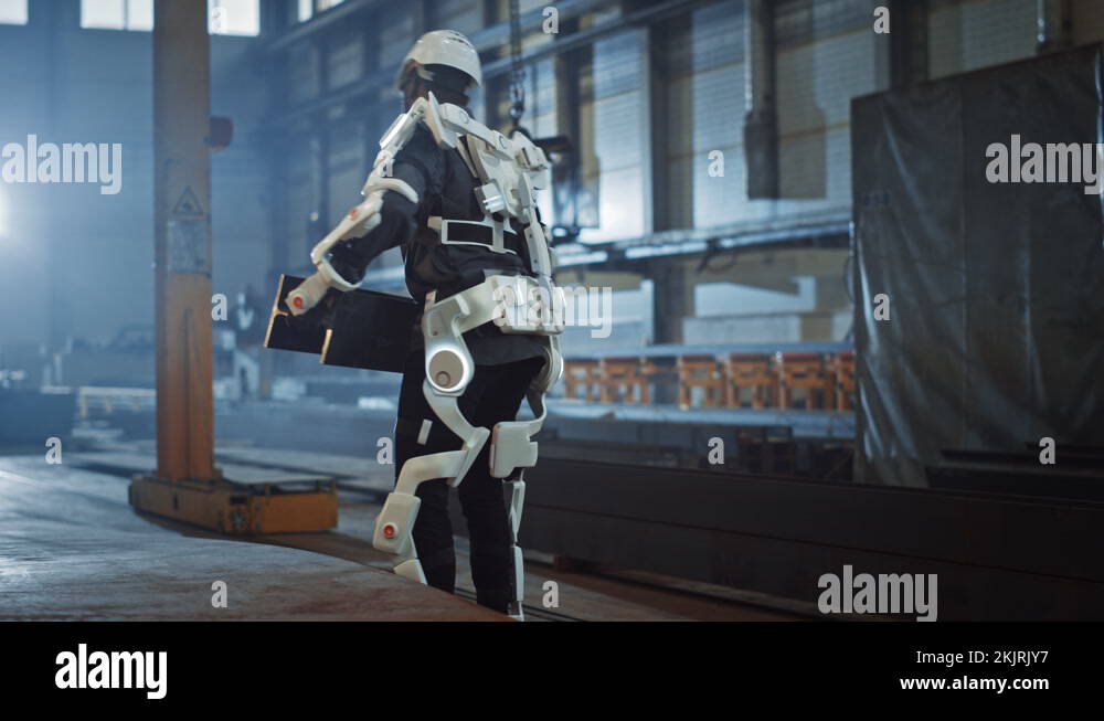 Industrial Factory Worker Wearing Exoskeleton Lifts Heavy Steel ... Industrial Factory Worker Wearing Exoskeleton Lifts Heavy Steel ...