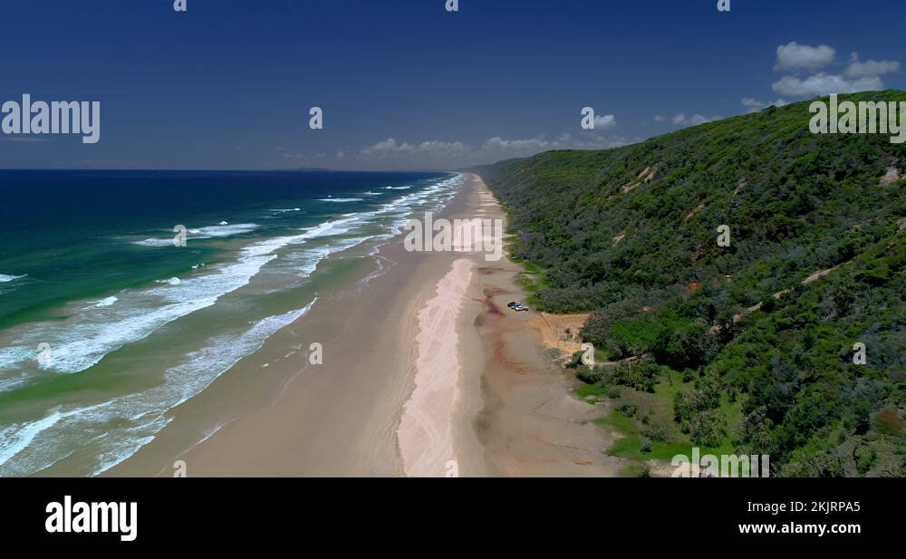 forward tracking aerial of beach with campers,Fraser Island,QLD ...