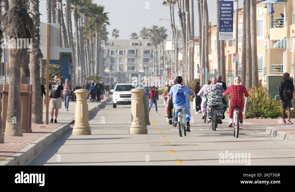 People walking, waterfront promenade beachfront boardwalk. Ocean beach ...