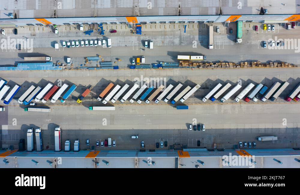 Logistics park with a warehouse - loading hub. Semi-trucks with freight ...