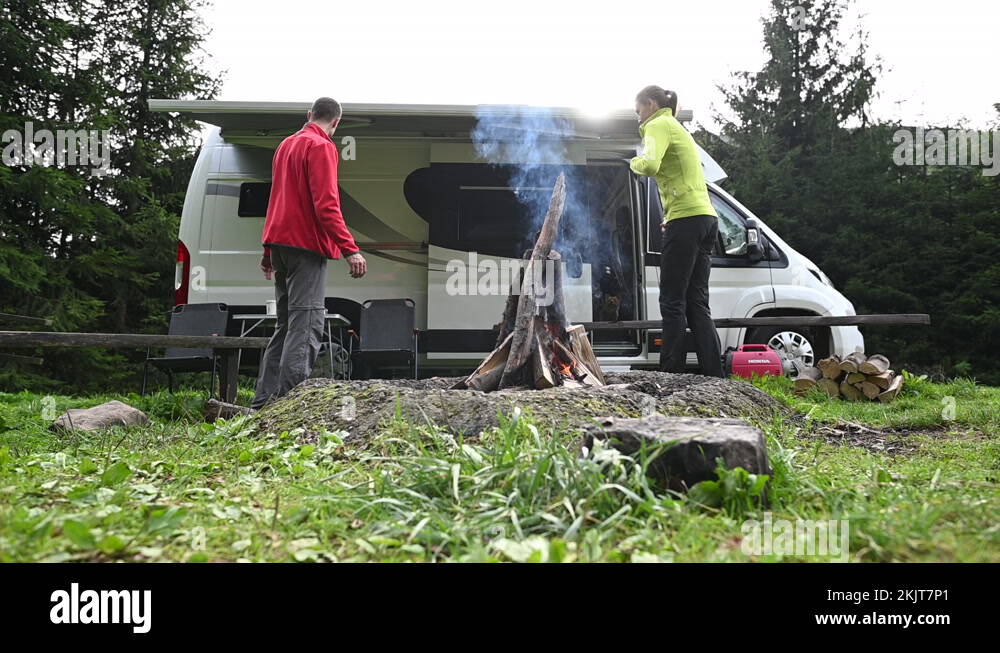Couple Making Campfire in Front of Their RV Camper Van Stock Video ...