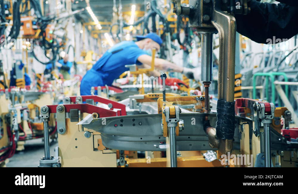 Spot welding of car part held in the car-making factory. Automobile ...