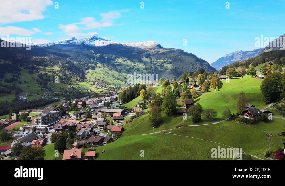 Famous city of Grindelwald in the Swiss Alps from above Stock Video ...