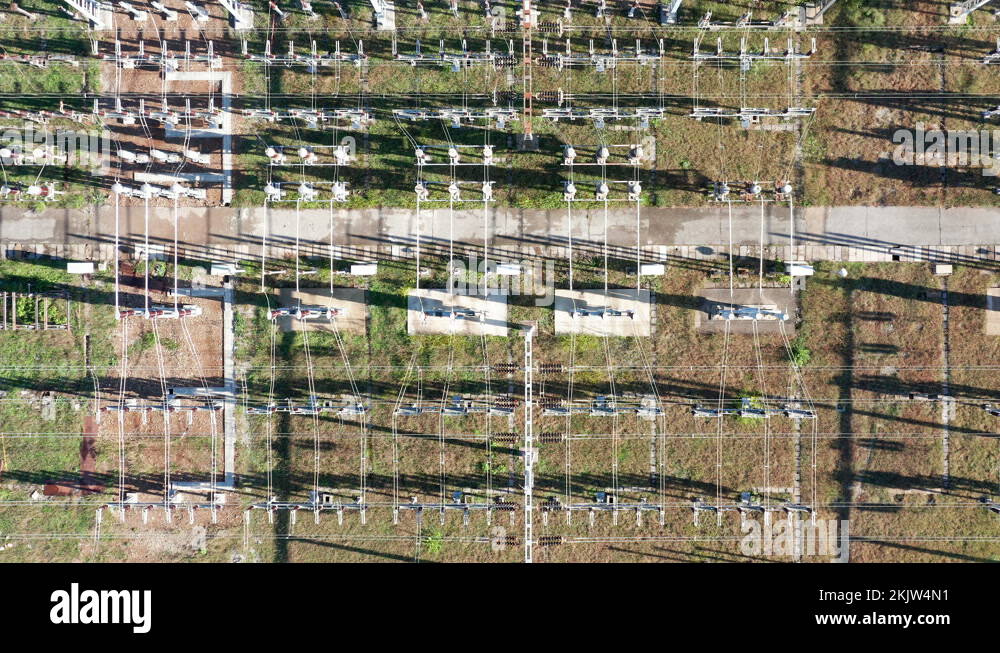 Electrical substation - grid of high voltage power lines and wires ...
