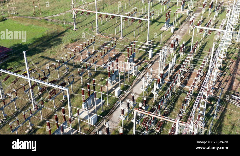 Electrical substation - grid of high voltage power lines and wires ...