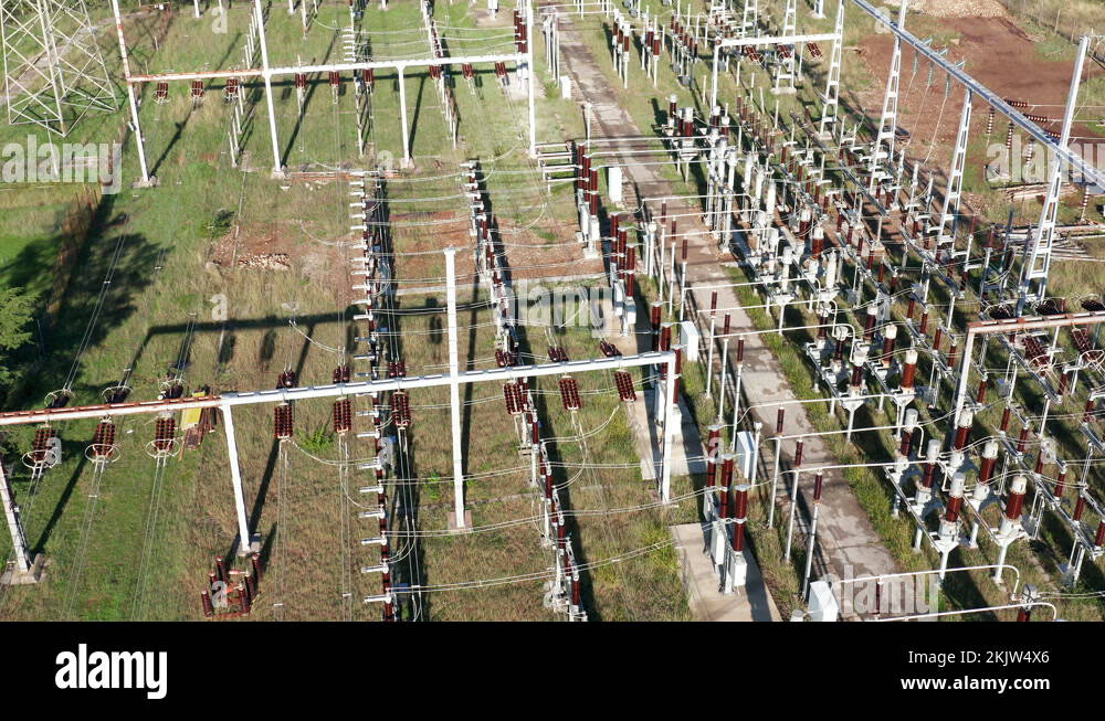 Electrical substation - grid of high voltage power lines and wires ...