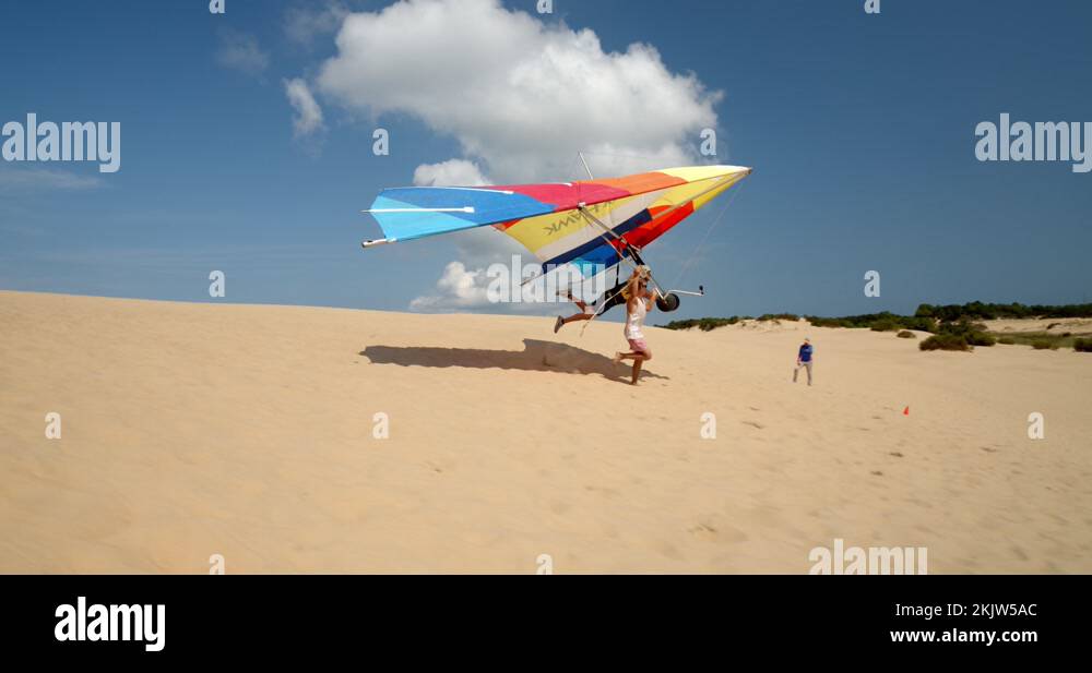 Launching Hang Glider on Sand Dunes, Teacher with Student, 4K Stock ...