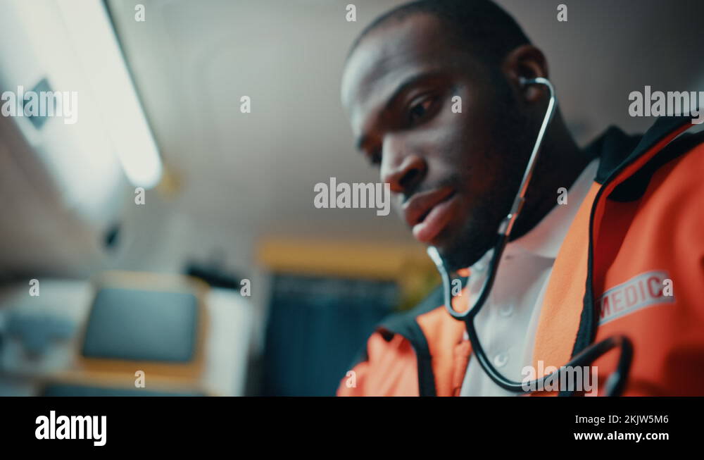 Paramedic Using Stethoscope on Patient in Ambulance Stock Video Footage ...
