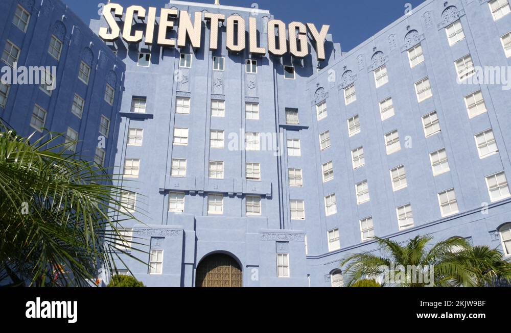Church of Scientology exterior, facade of blue building, logo and cross ...