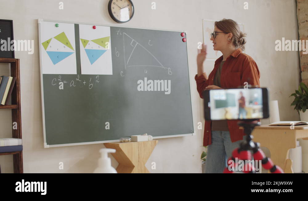 Female Teacher Giving Live Video Lesson from School Classroom Stock ...