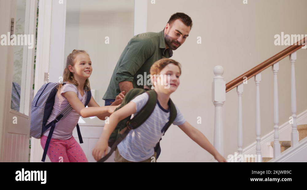 Caucasian family entering the front door of their house Stock Video ...