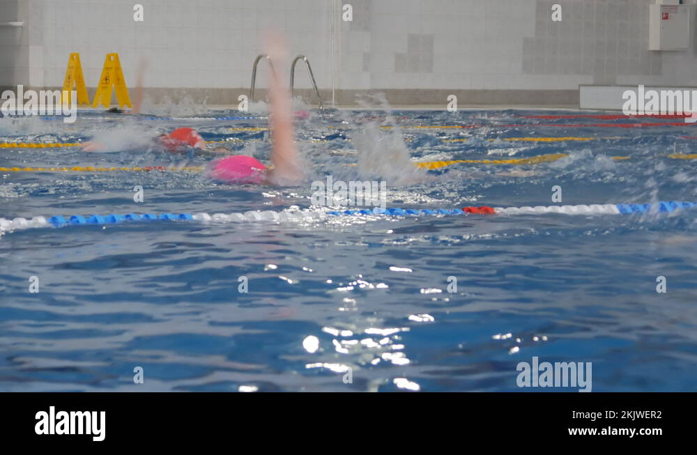 there are swimming competitions among teenagers. Athletes swim on their ...