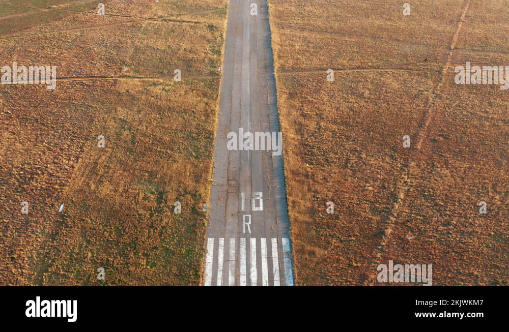 Empty runway of a small airport used for takeoff and landing of light ...