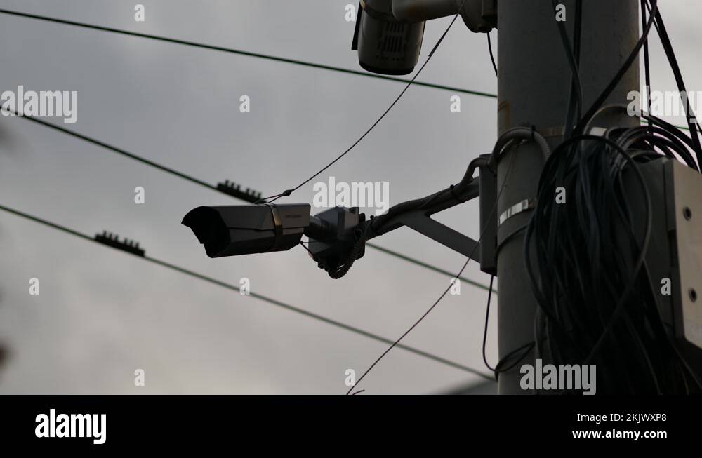 Surveillance camera on a street pole. CCTV camera on a concrete ...