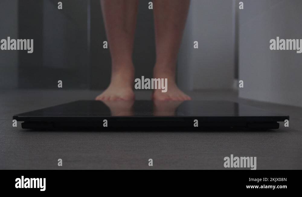 overweight woman measuring herself on a scale crying Stock Video ...