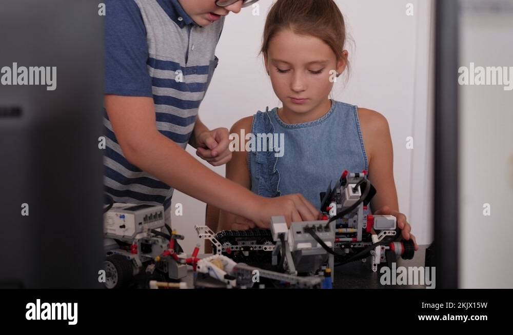 School children in robotics school makes robot managed from the ...